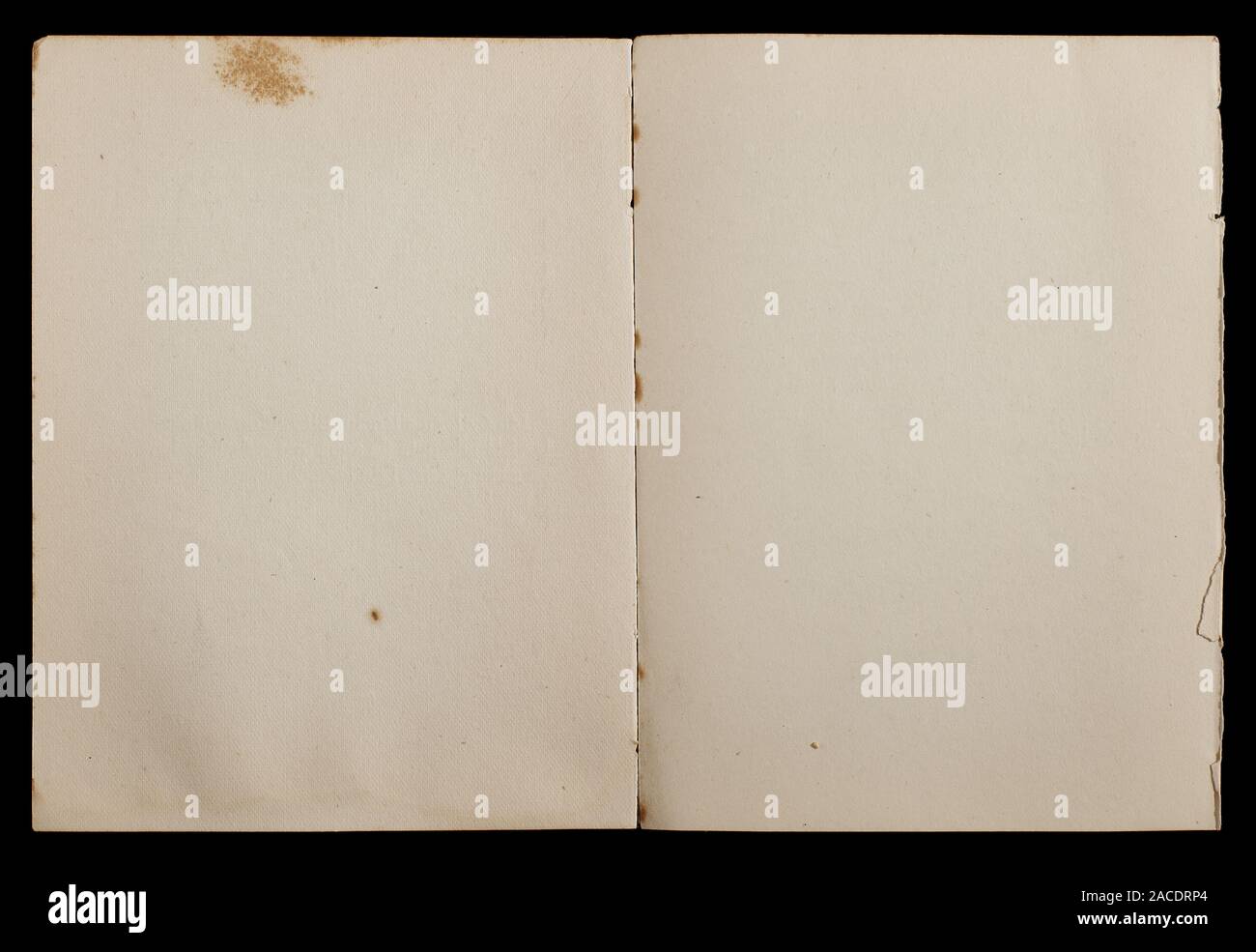 Antique book unfolded showing textured pages isolated on black ...