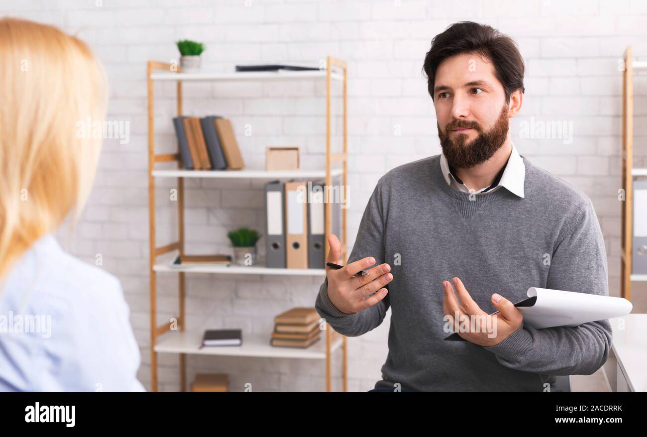 Psychotherapist explaining ways of solving problems to patient Stock ...