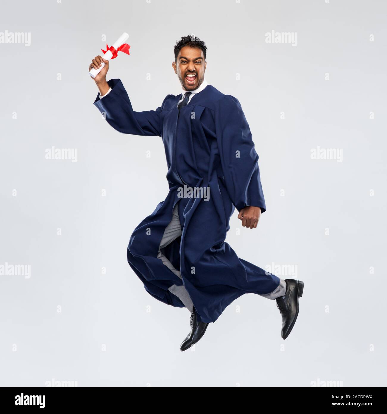 happy jumping indian graduate student with diploma Stock Photo - Alamy