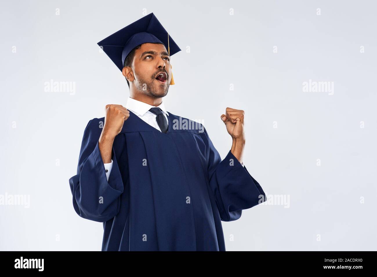 happy indian graduate student celebrating success Stock Photo - Alamy