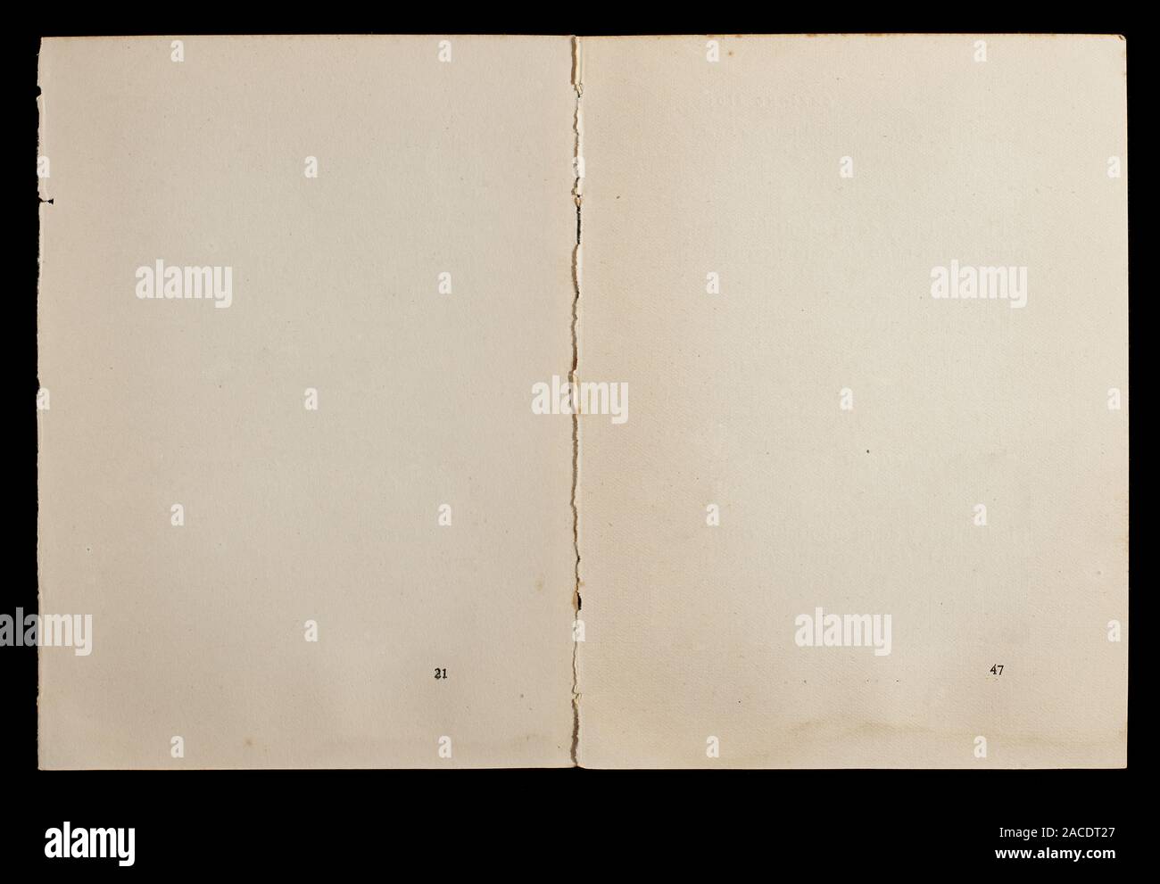 Antique book unfolded showing textured pages isolated on black ...