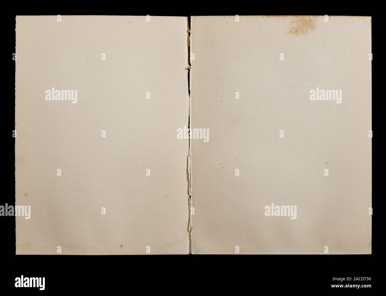 Antique book unfolded showing textured pages isolated on black ...