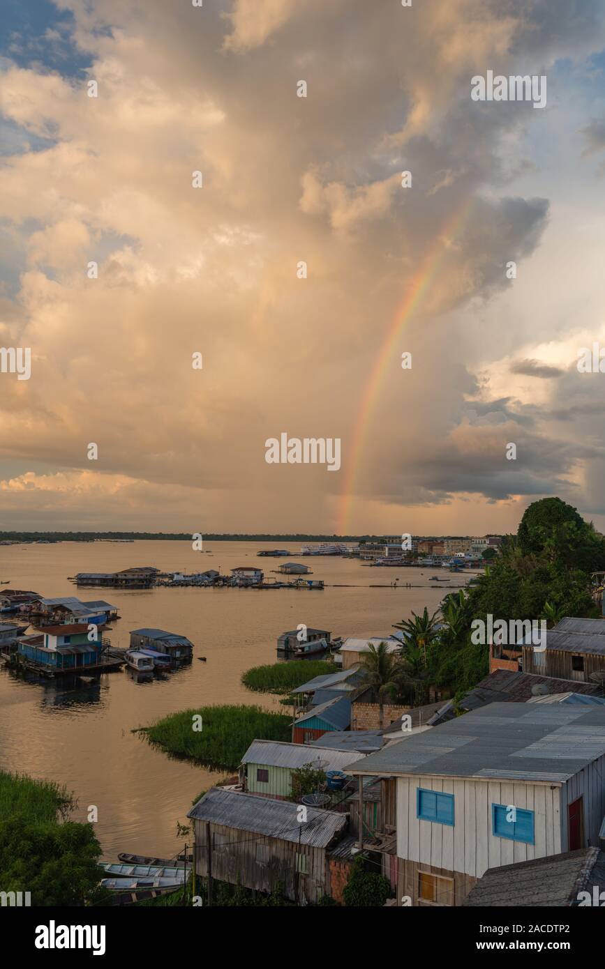Twilight hour over the swimming houses on Lake Tefé, small town of Tefé ...