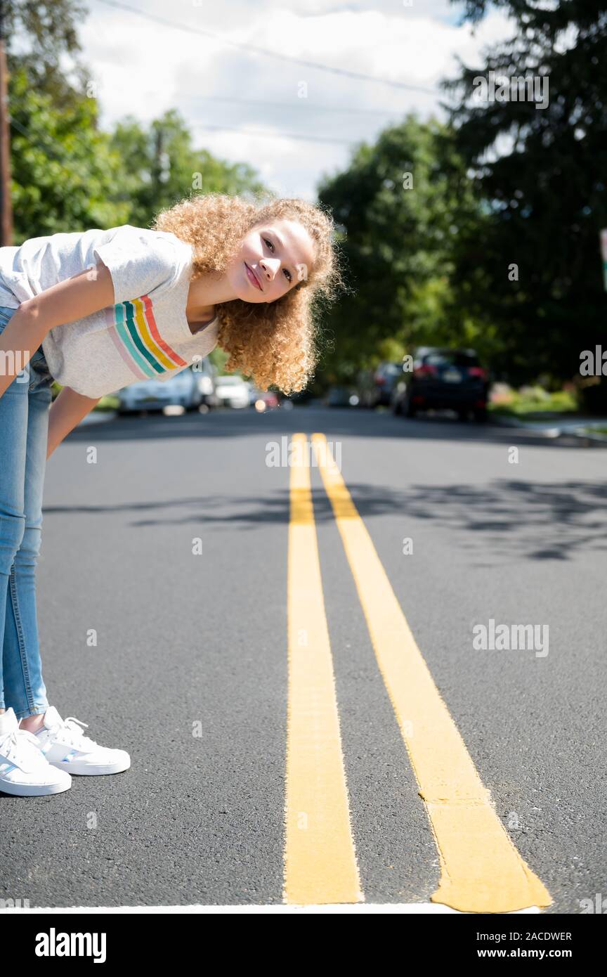 Child girl jeans standing hi-res stock photography and images - Alamy