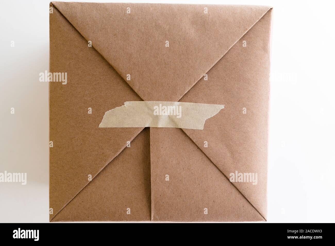 Tape on brown envelope Stock Photo - Alamy
