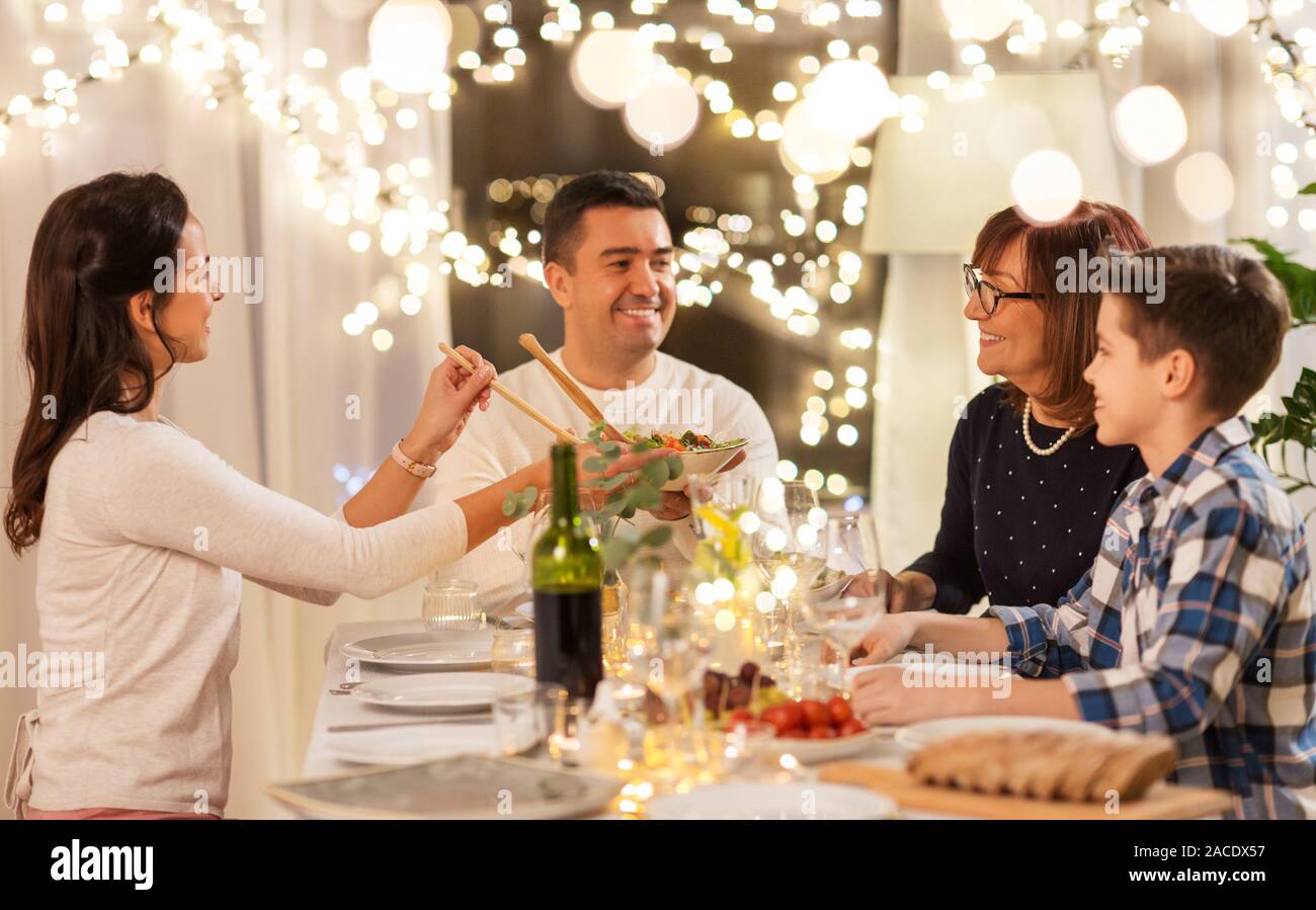 happy family having dinner party at home Stock Photo - Alamy