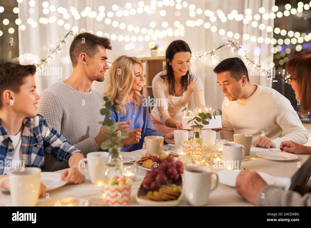 happy family having birthday party at home Stock Photo - Alamy