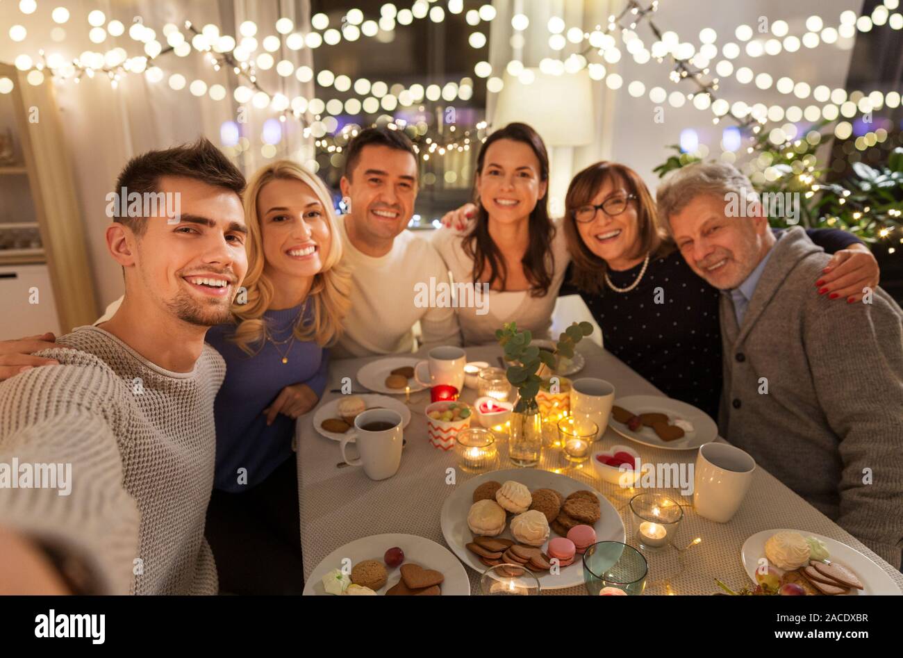 happy family taking selfie at tea party at home Stock Photo - Alamy