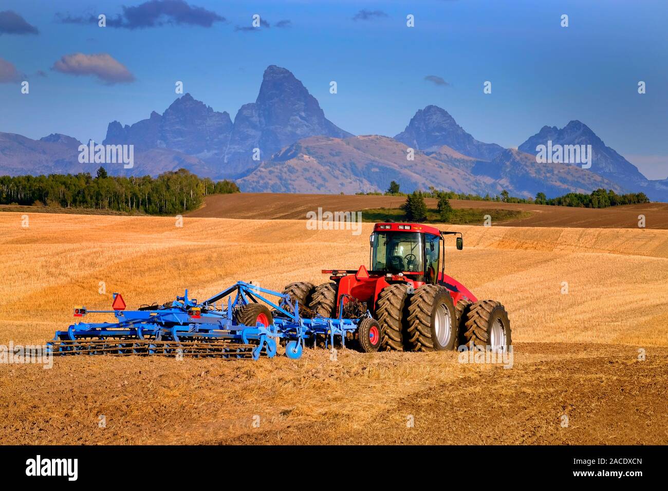 Tractor Equipment Farming Ground Harvesting crops in fall Autumn with ...