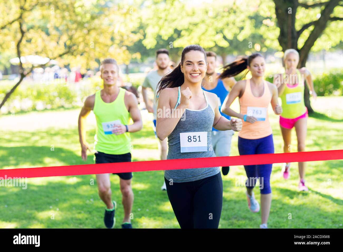Female athlete crossing finish line hi-res stock photography and images ...