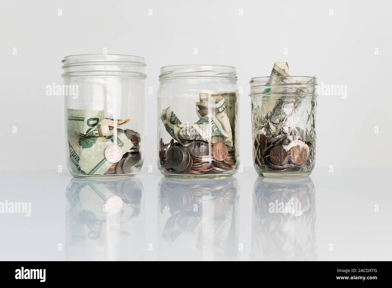 Group savings jars hi-res stock photography and images - Alamy