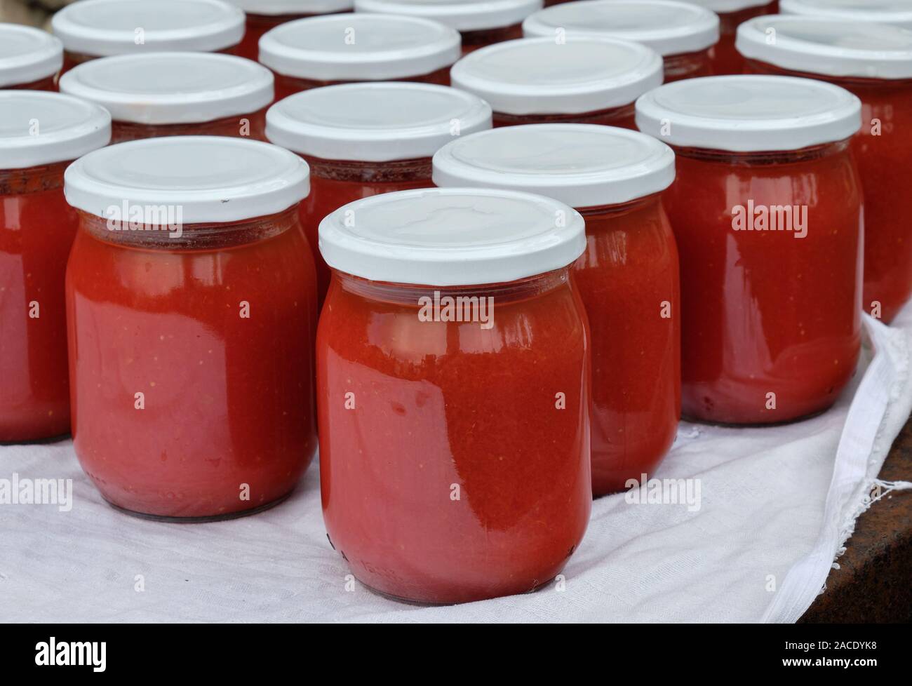 Jars of freshly made tomato puree at an organic farm in Italy Stock ...