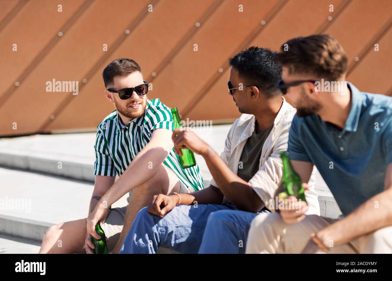 Drinking beer sitting on street hi-res stock photography and images - Alamy