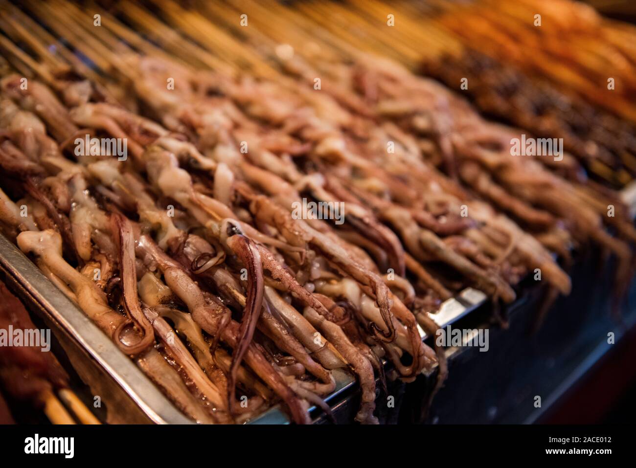 Fried and rosted octopus in a food market in Beijing, China Stock Photo ...