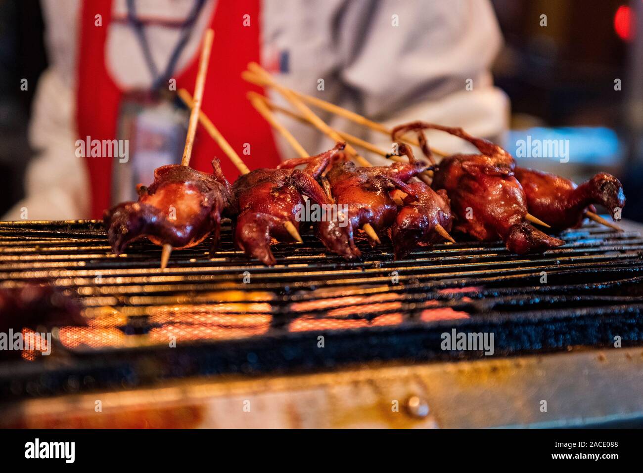 Fried pigeons in a food market in Beijing, China Stock Photo - Alamy