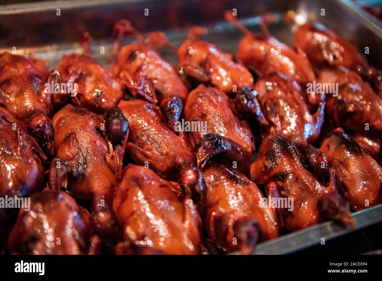Fried pigeons in a food market in Beijing, China Stock Photo - Alamy