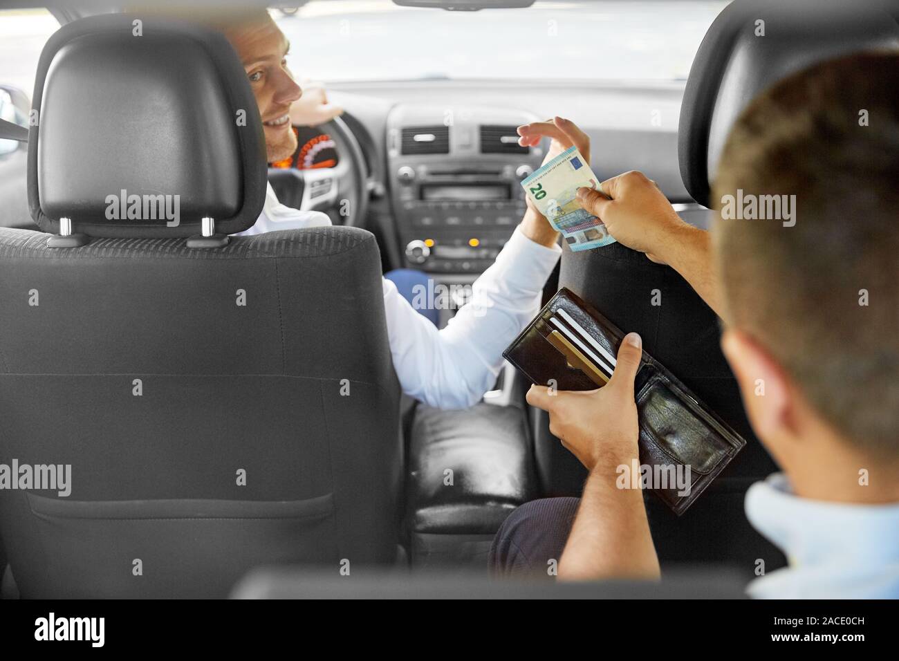 Young man money taking hi-res stock photography and images - Alamy