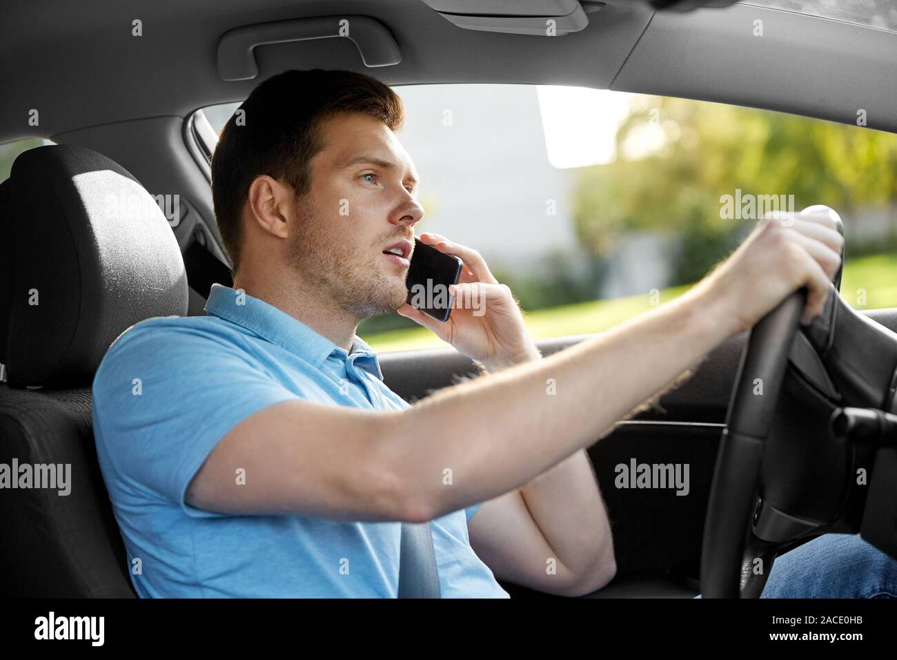 man driving car and calling on smartphone Stock Photo - Alamy