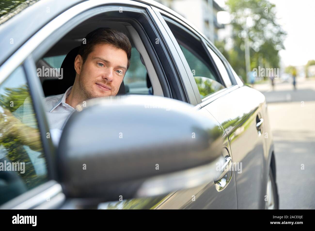 Back of man looking in mirror hi-res stock photography and images - Alamy