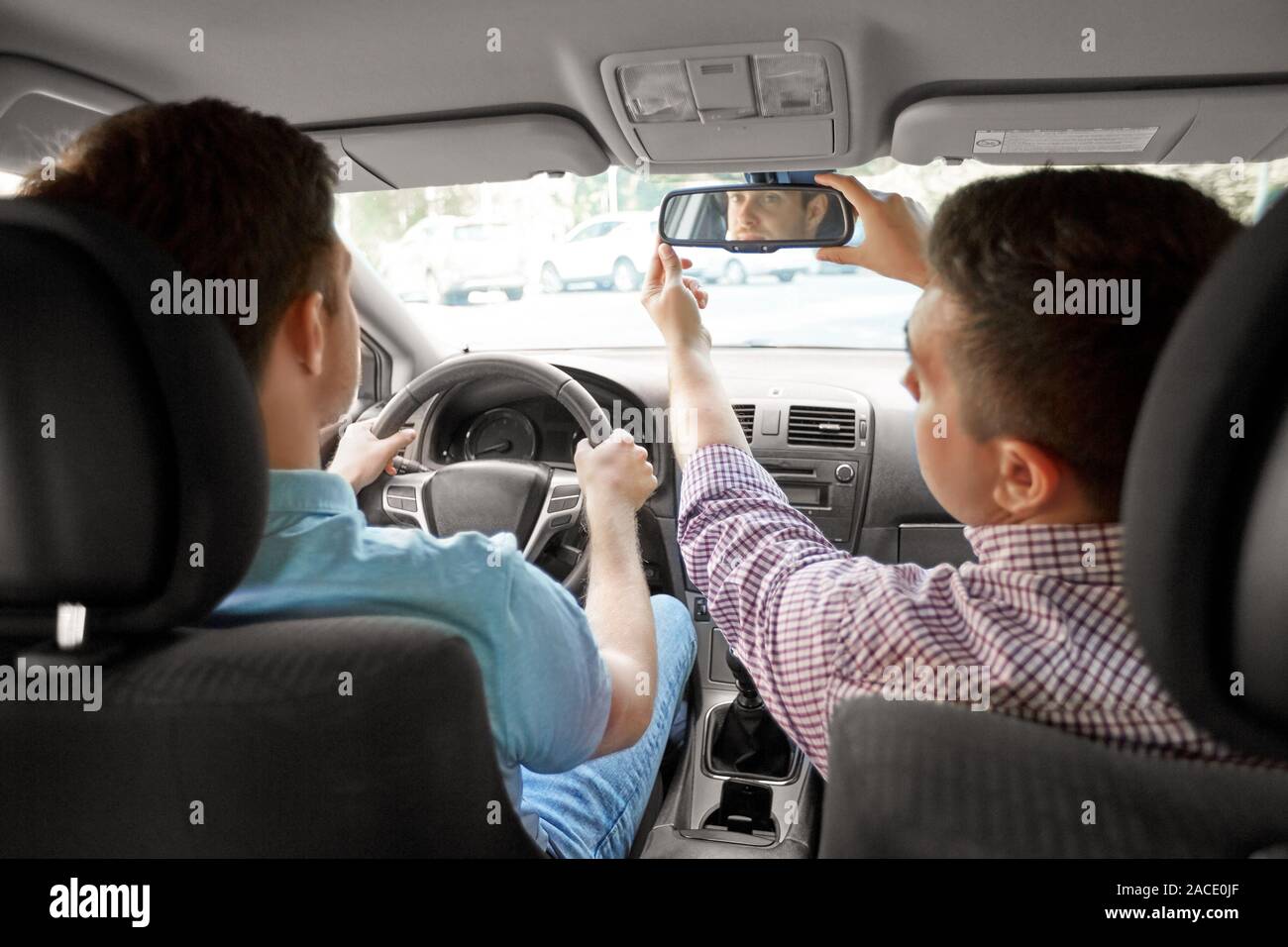 car driving school instructor teaching man driver Stock Photo - Alamy