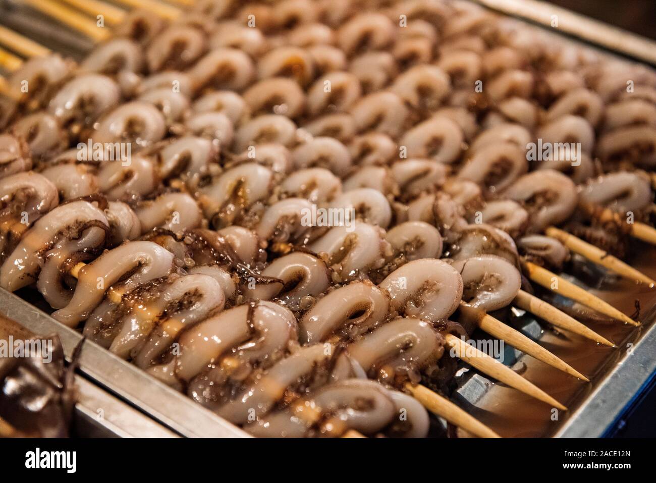 Fried and rosted octopus in a food market in Beijing, China Stock Photo ...