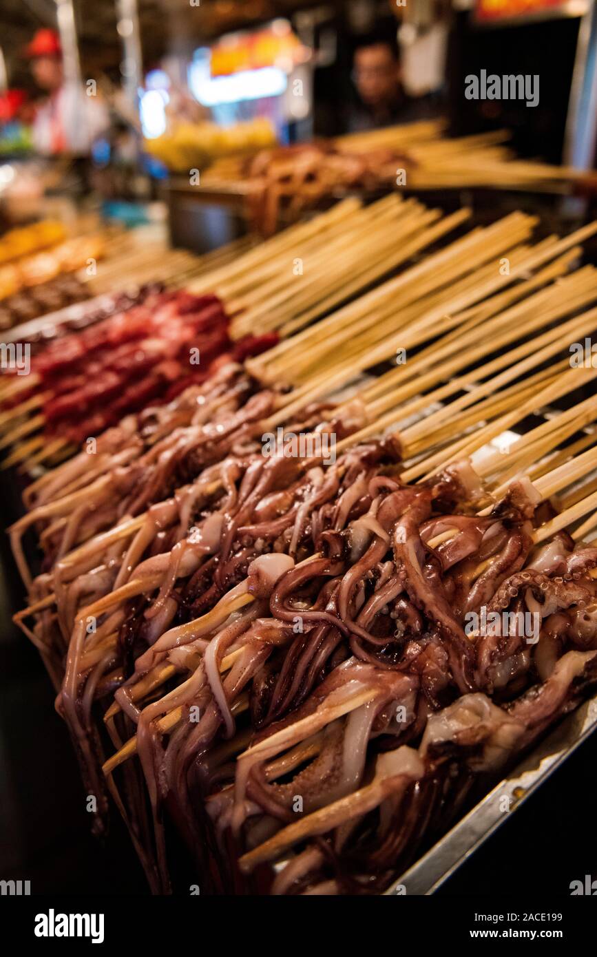 Fried and rosted octopus in a food market in Beijing, China Stock Photo ...
