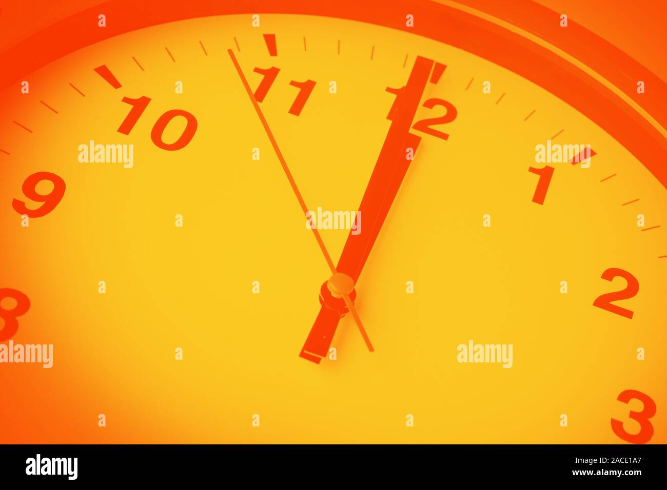 5 to 12 clock concept on yellow background Stock Photo - Alamy