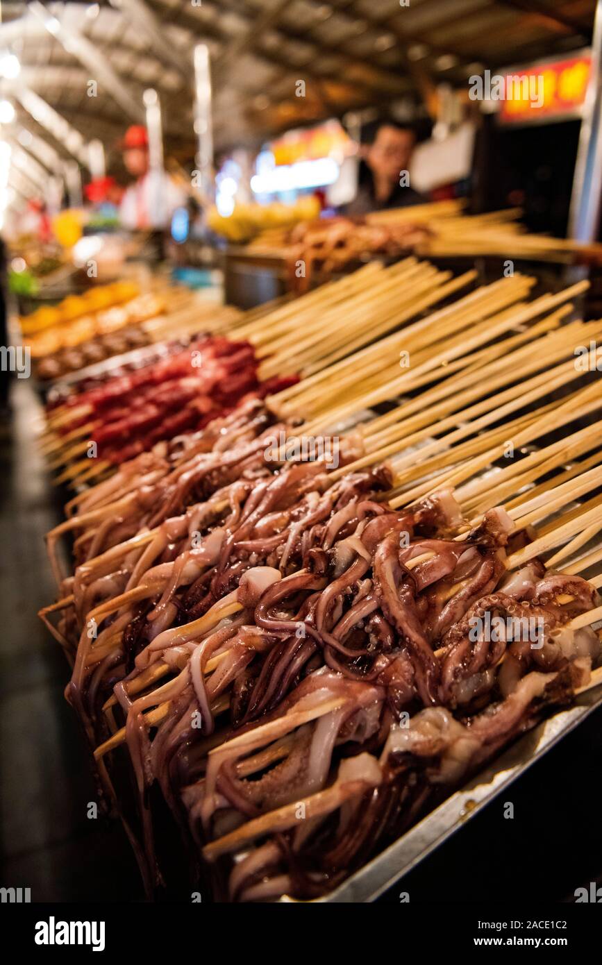 Fried and rosted octopus in a food market in Beijing, China Stock Photo ...