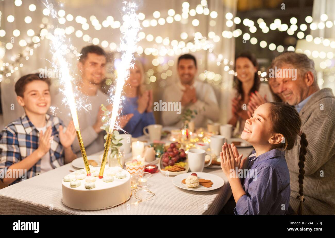 happy family having dinner party at home Stock Photo - Alamy