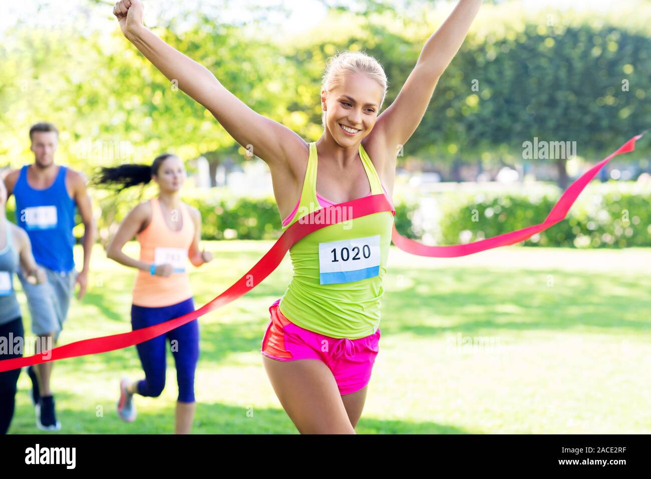 Runner crossing the finish line hi-res stock photography and images - Alamy