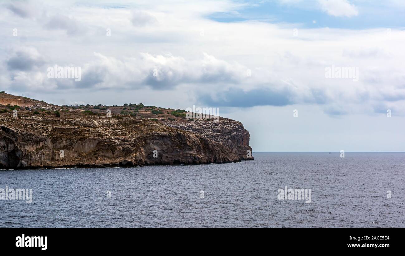 Steep cliff leading to Mediterranean Sea in the South of Malta Stock ...