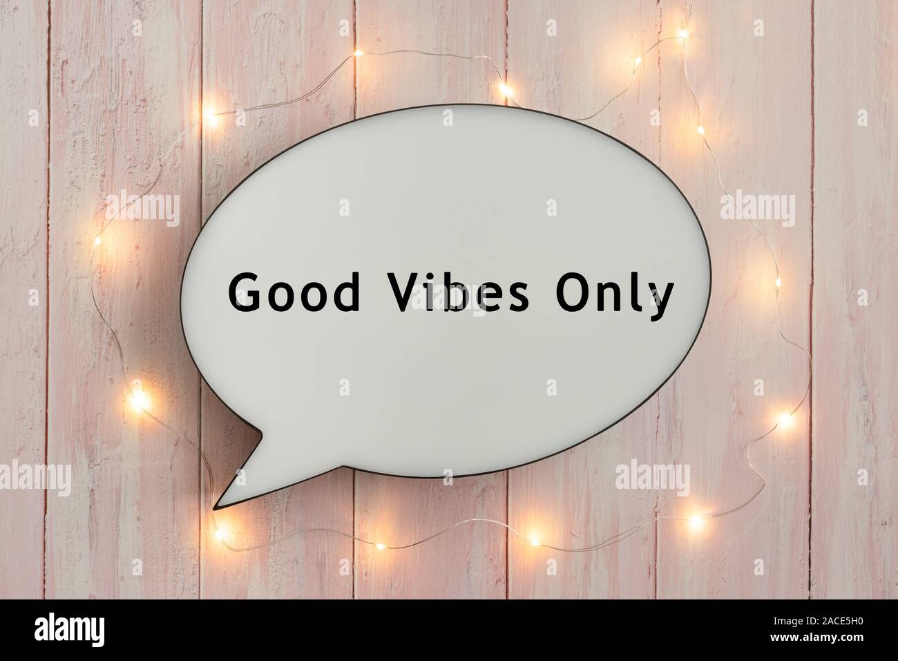 Good Vibes Only written on speech bubble, surrounded by bright lights ...