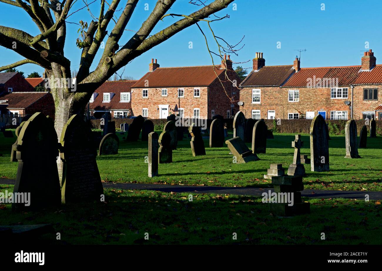 Houses, and the graveyard of St Mary's Church, in the village of ...