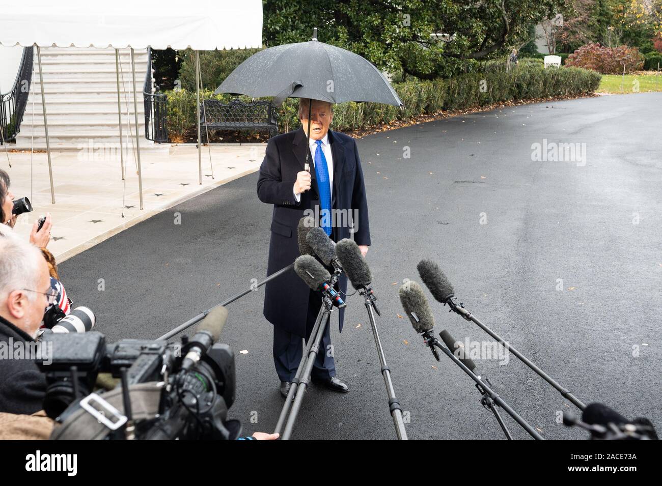 President Donald Trump talking to the press as he leaves the White ...