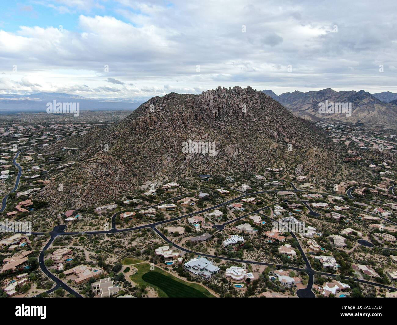 Aerial view of upscale luxury homes with dry landscape mountain and ...