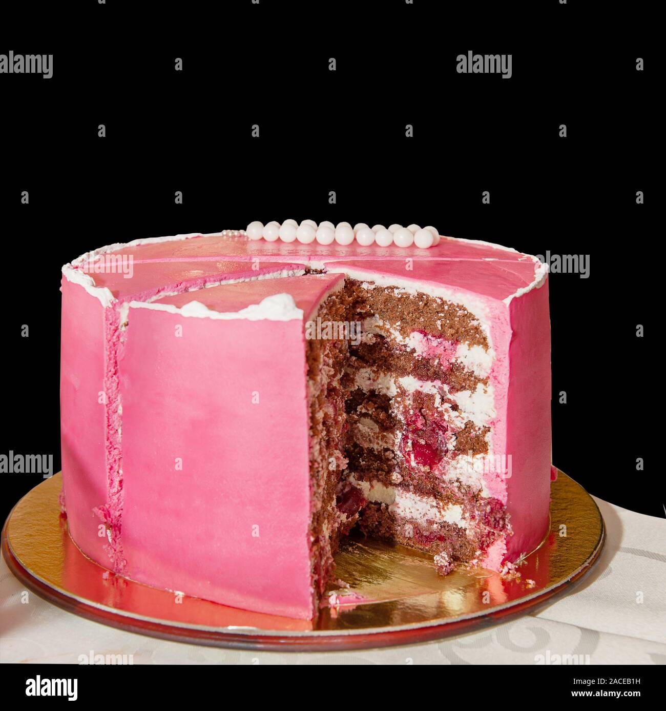 Delicious pink high layered cake for christening or birthday. Cut a ...