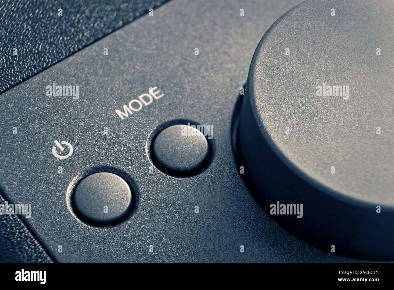 Detail of dark grey DAB radio with round on off and mode button Stock ...