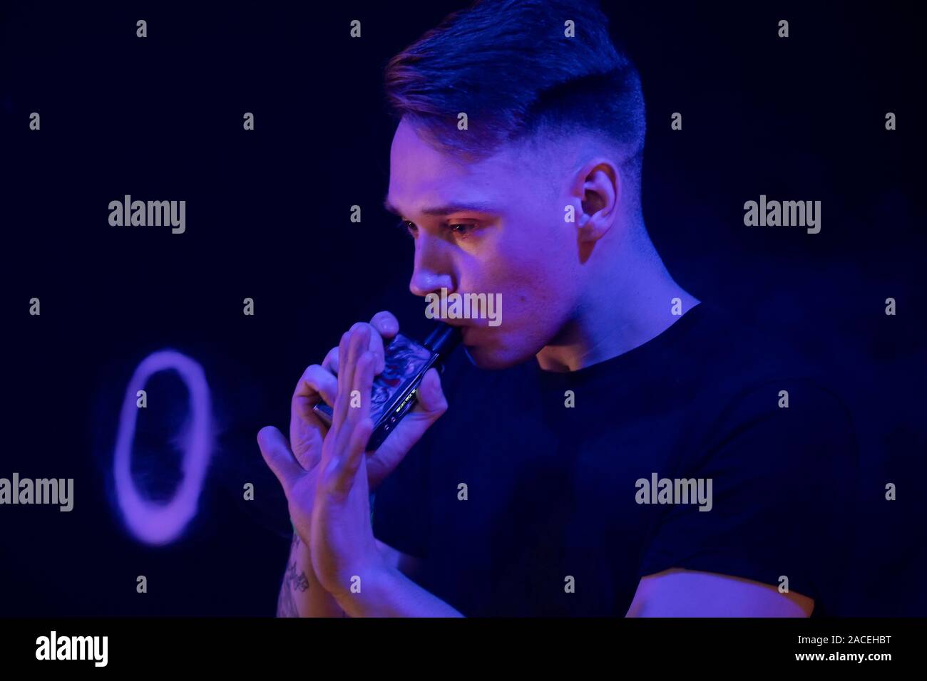 Moscow, Russia. 1st of December, 2019 A participant of Vape Tricks ...