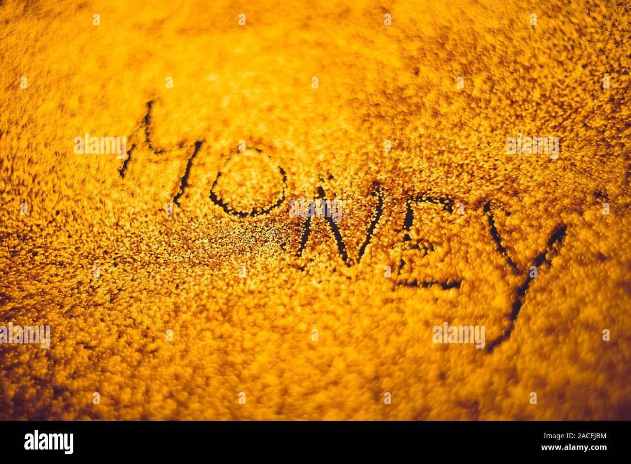Black text Money on shiny golden background Stock Photo - Alamy