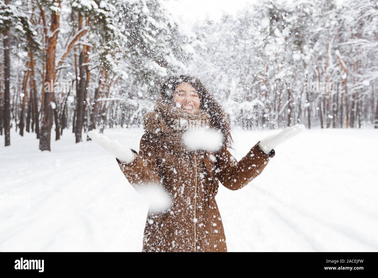 Girl enjoying snowfall hi-res stock photography and images - Alamy