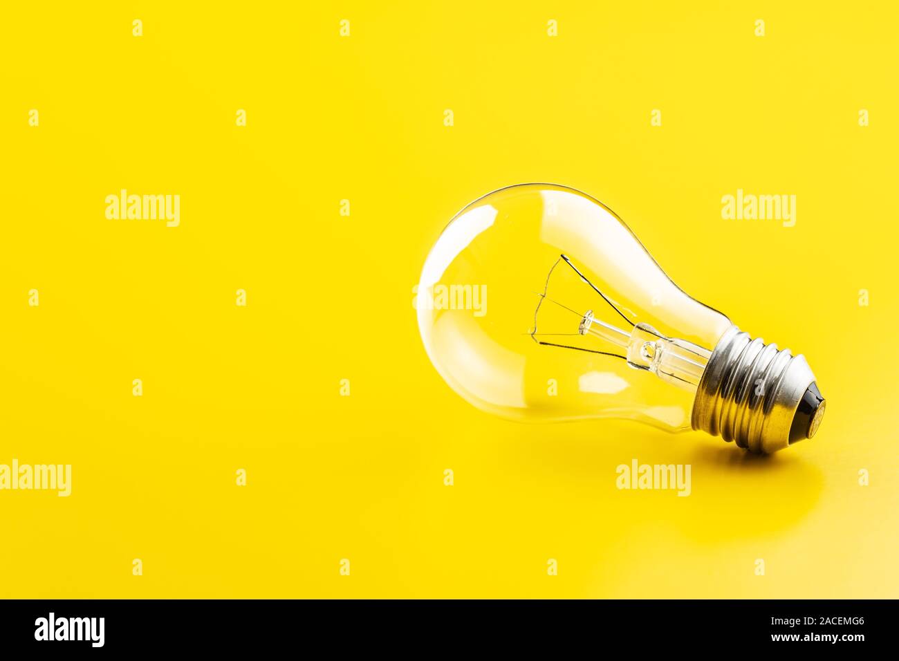 Light bulb yellow background hi-res stock photography and images - Alamy