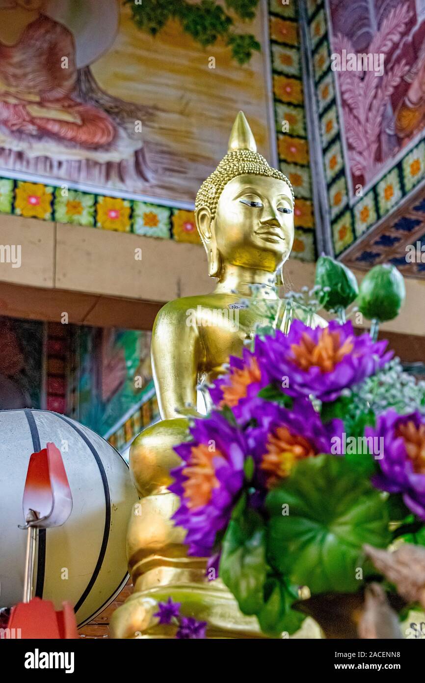 Sri Lanka, Colombo - August 2015: Golden Buddha statue and offerings at ...