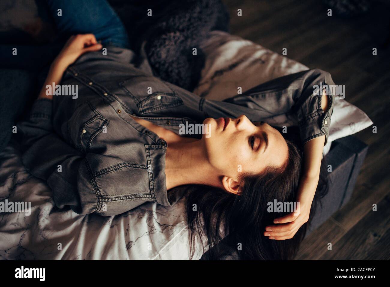 Young Woman Sleeping and relaxi in her bed Stock Photo - Alamy