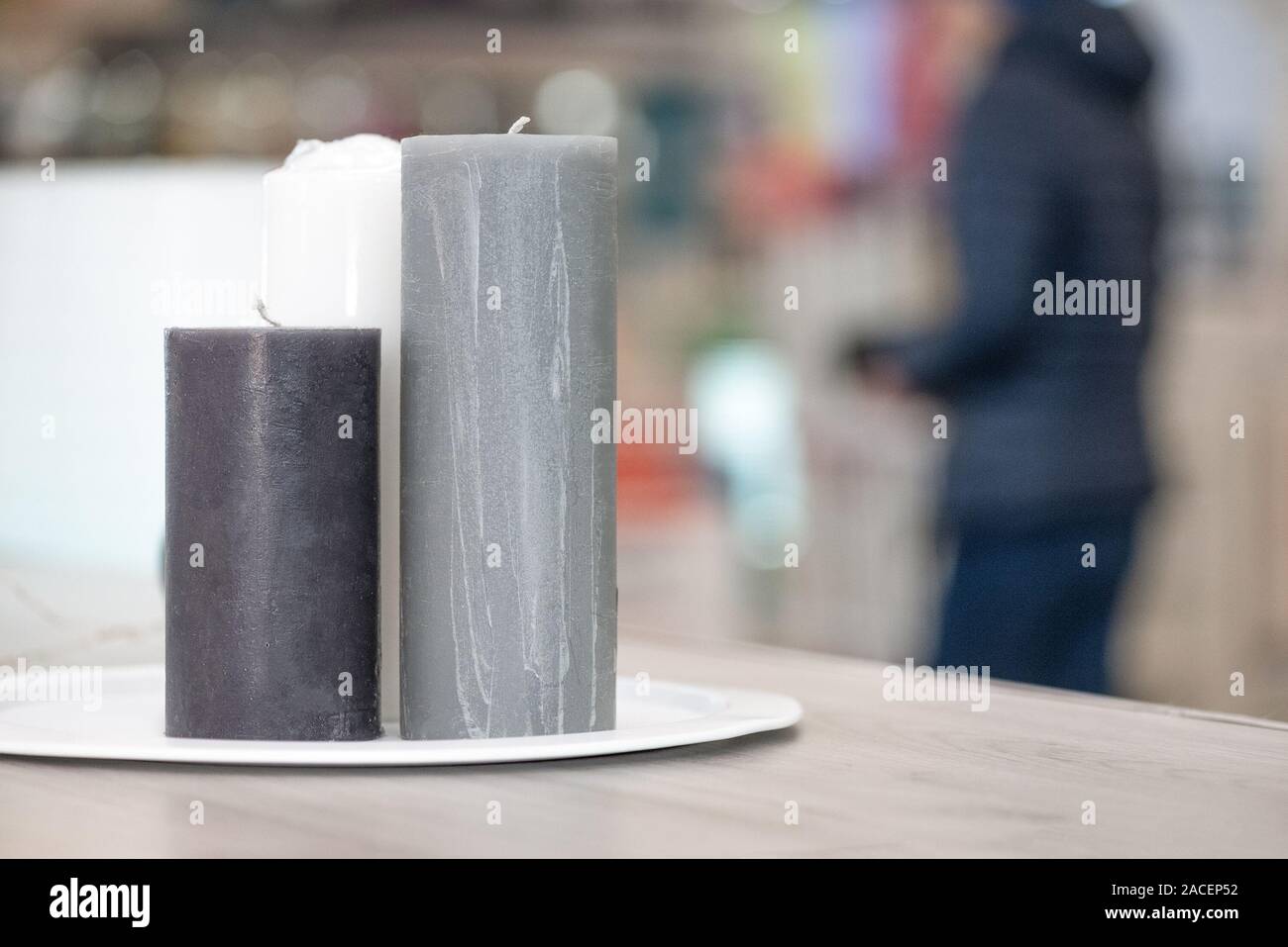 New candles on a market stall in the shop background Stock Photo - Alamy