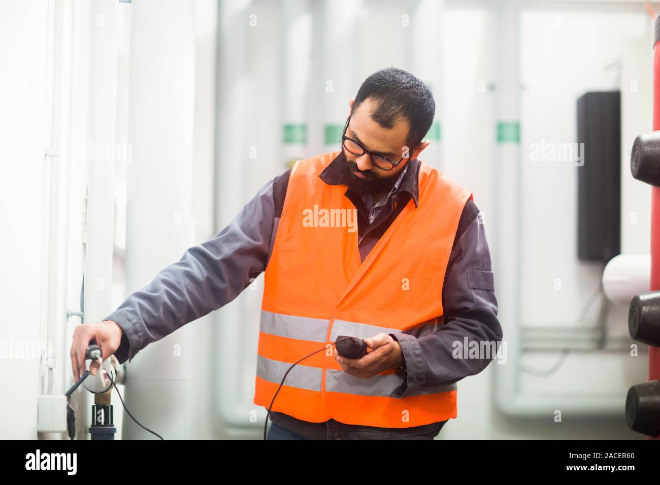 heating engineer checking system Stock Photo - Alamy