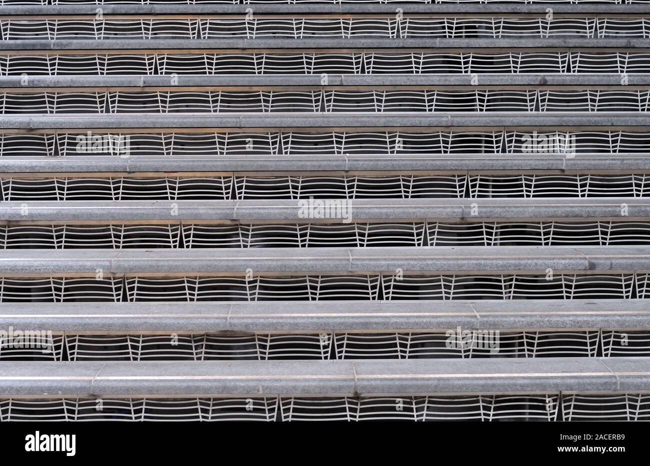 metal steps of an outdoor stairway in a city with grid pattern Stock ...