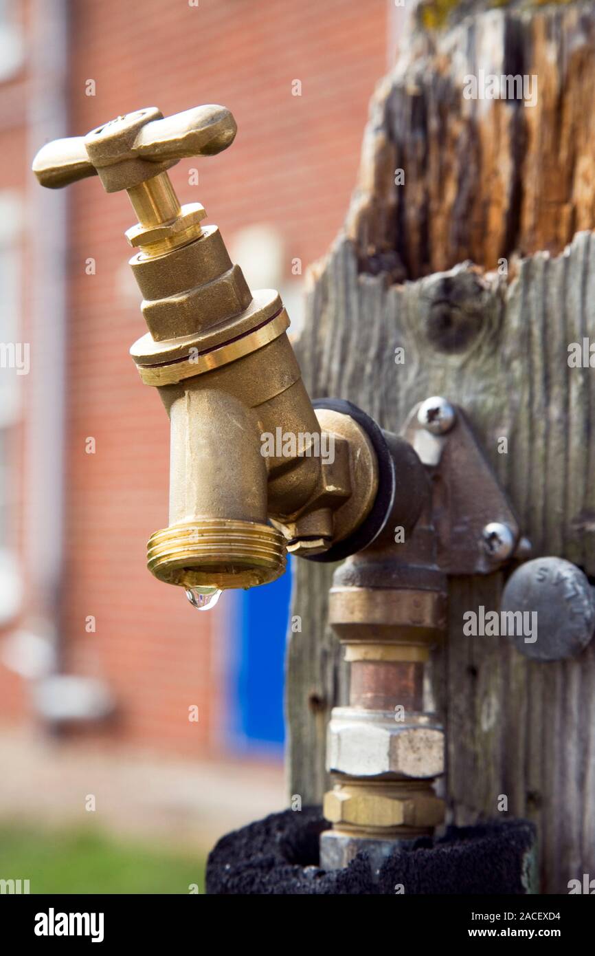 Outdoor tap, dripping water. Failing to completely turn off outdoor ...