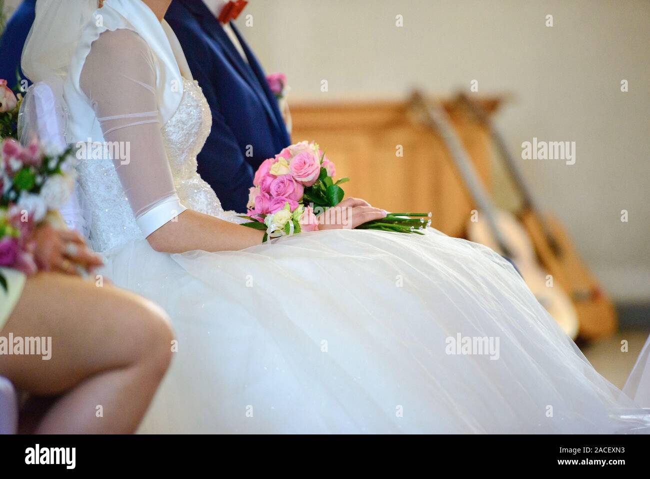 Bride and groom at church wedding during ceremony. Beautiful decoration ...