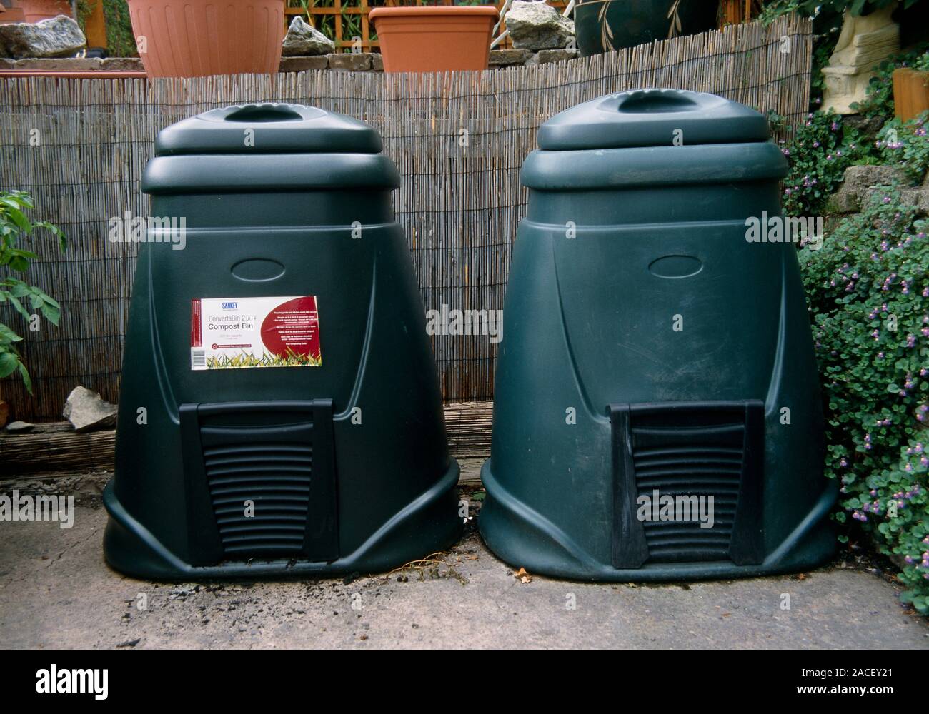 Compost bins. Two plastic compost bins in a garden Stock Photo - Alamy