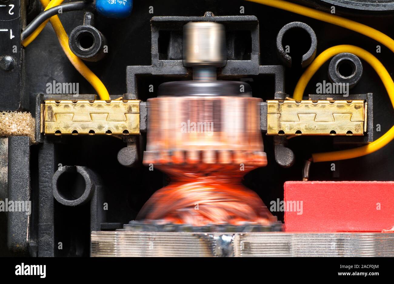 Electric motor rotating. Close up of part of the electric motor of a ...